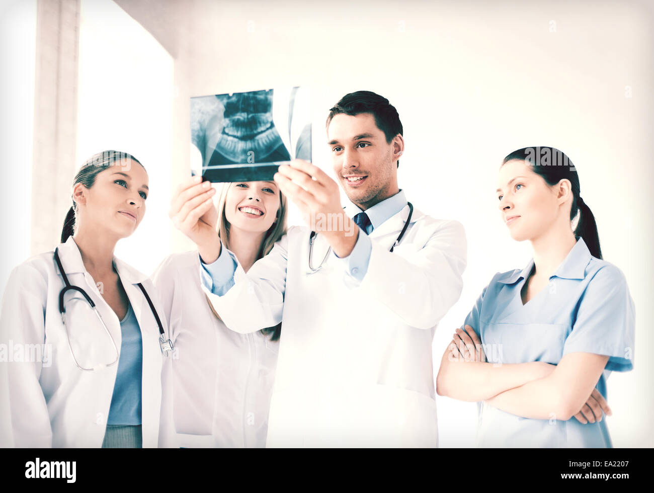 young group of doctors looking at x-ray Stock Photo - Alamy