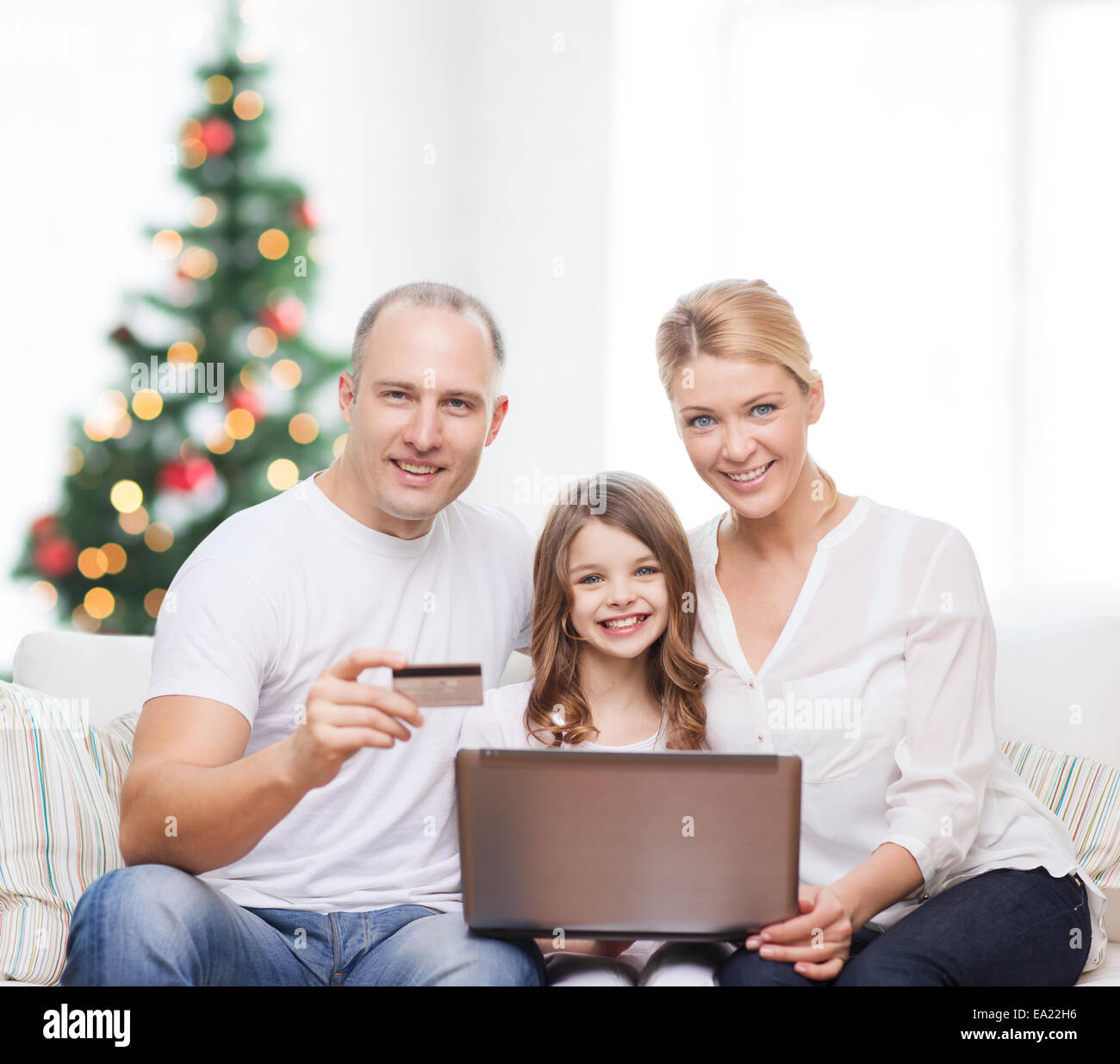 happy family with laptop computer Stock Photo - Alamy