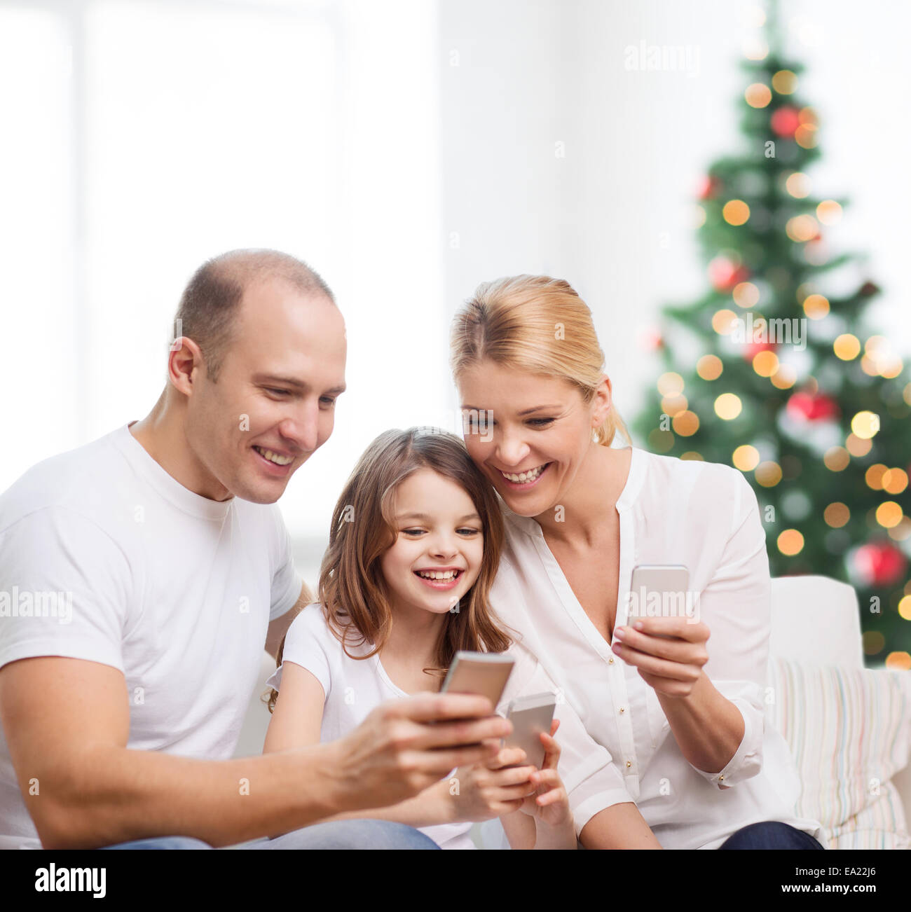 happy family with smartphones Stock Photo - Alamy