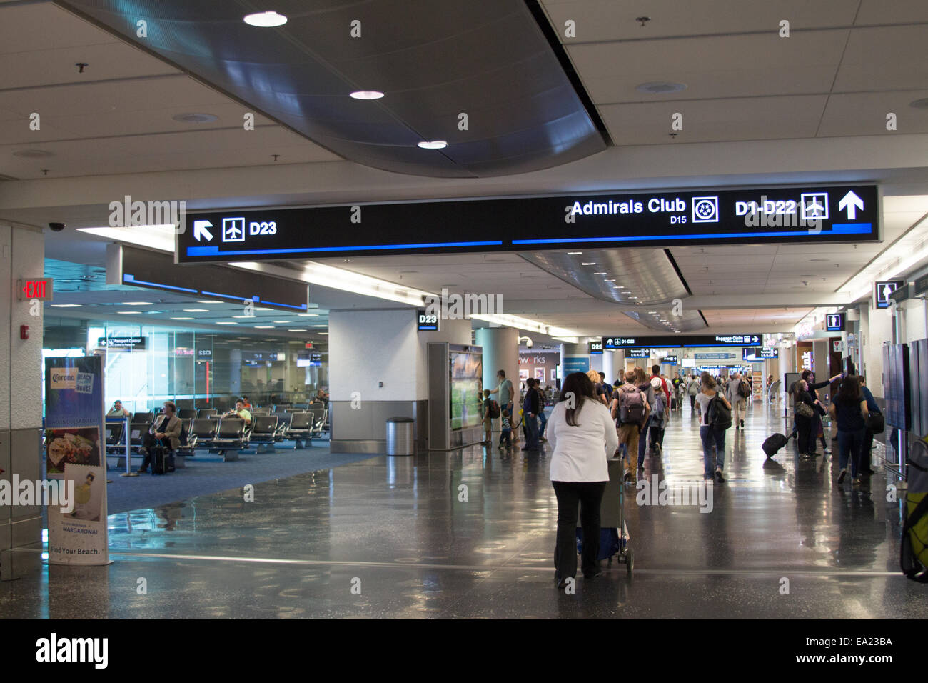 Passengers walking through Concourse D at Miami International Airport ...