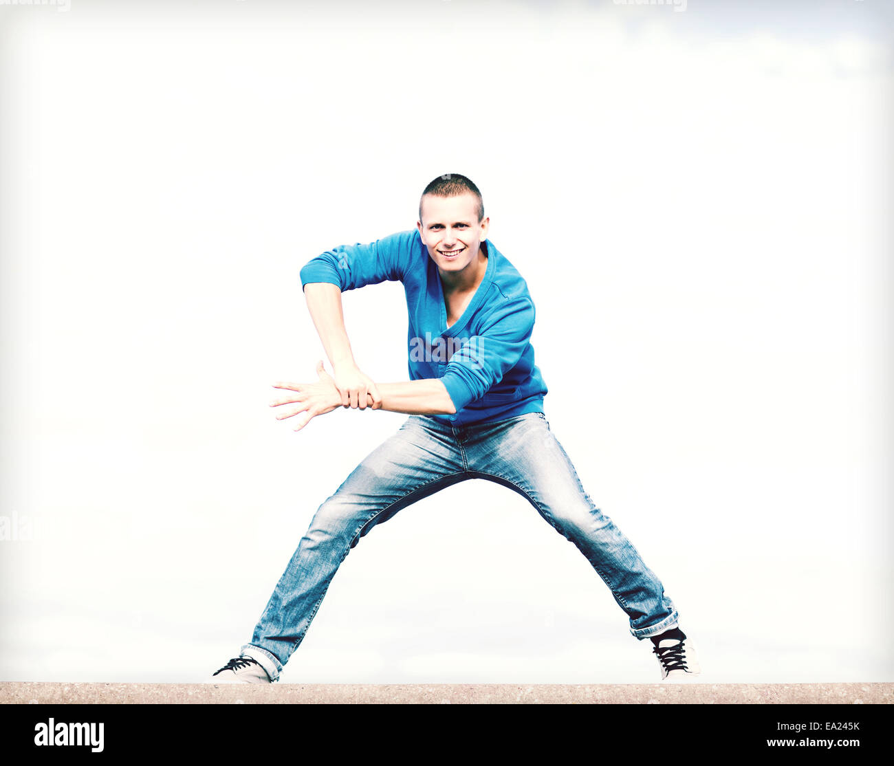 handsome boy making dance move Stock Photo - Alamy