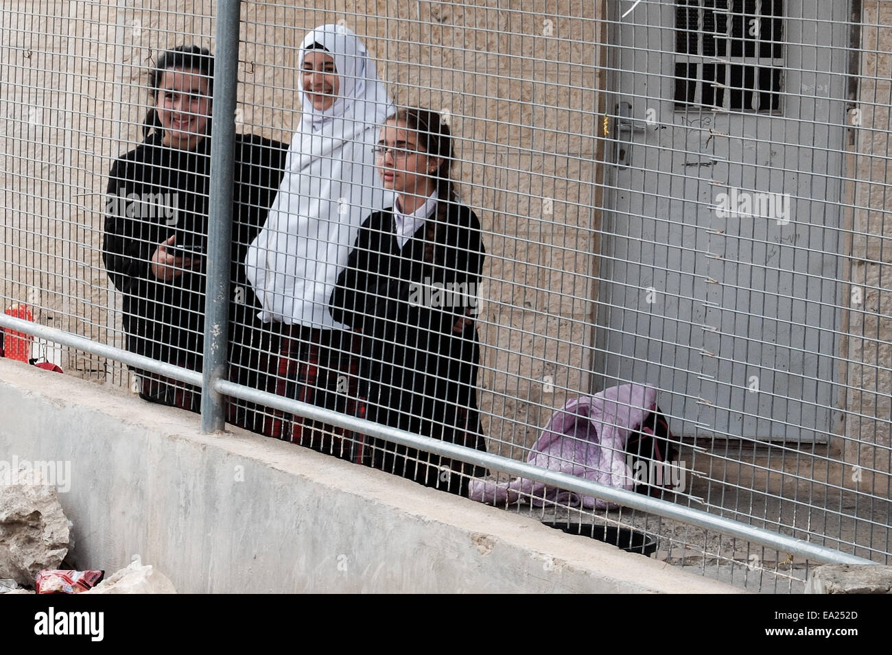 Jerusalem. 05th Nov, 2014. Young Arab girls peer through a fence in the ...