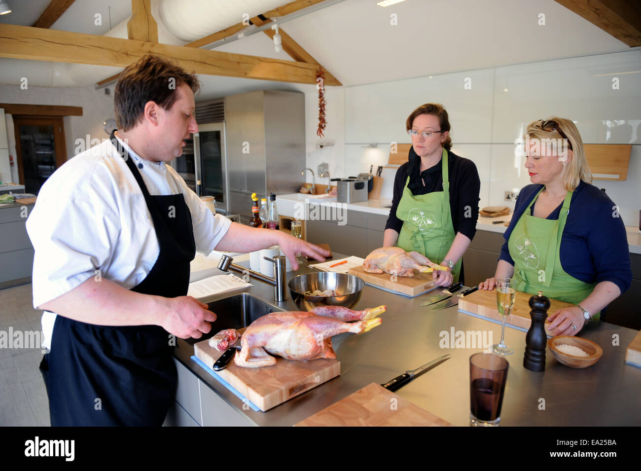 Learning how to chop up a chicken during a cookery course at Thyme at ...