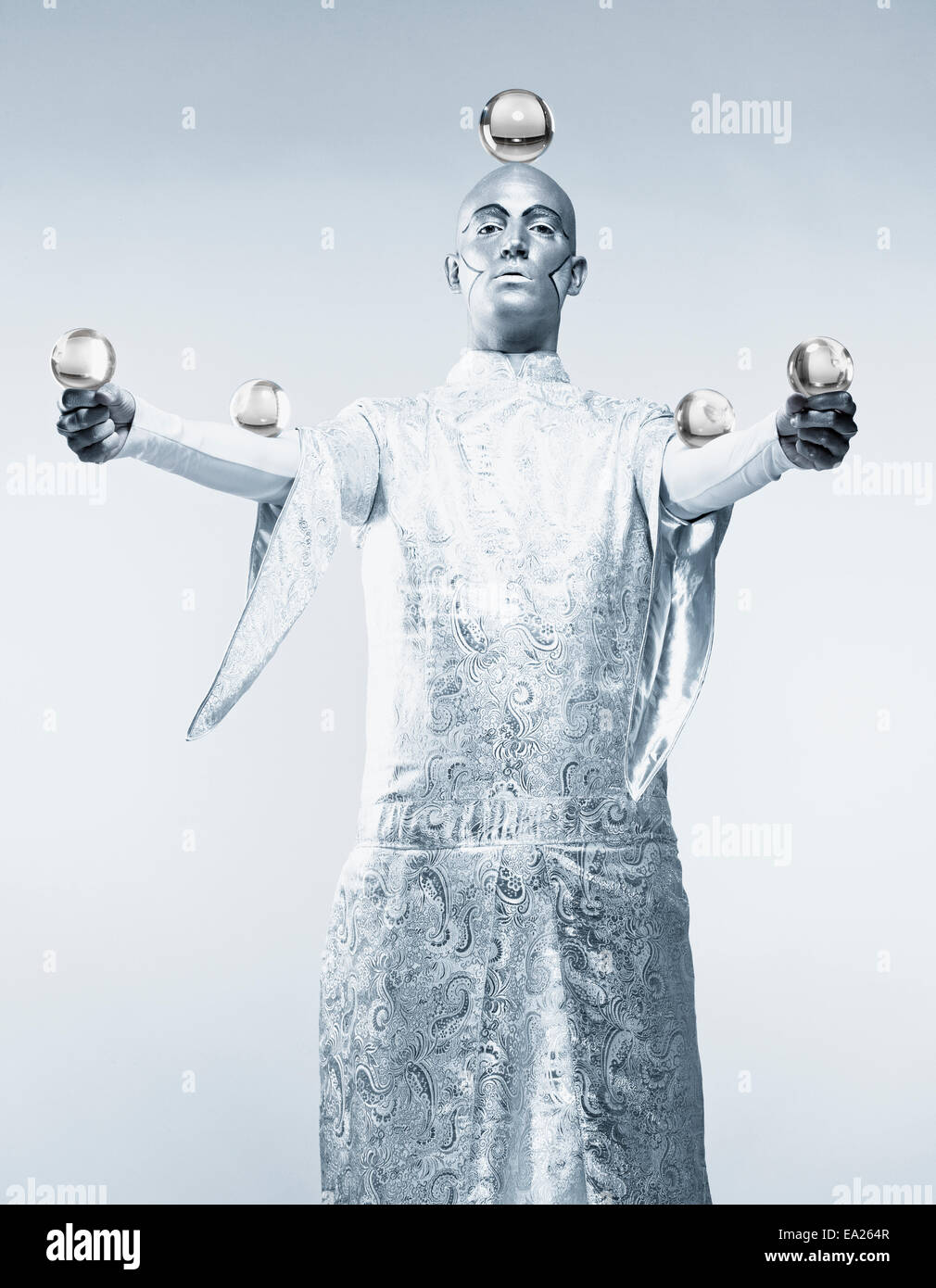 Magician with Glass Balls in Stage Makeup and Costume Stock Photo - Alamy