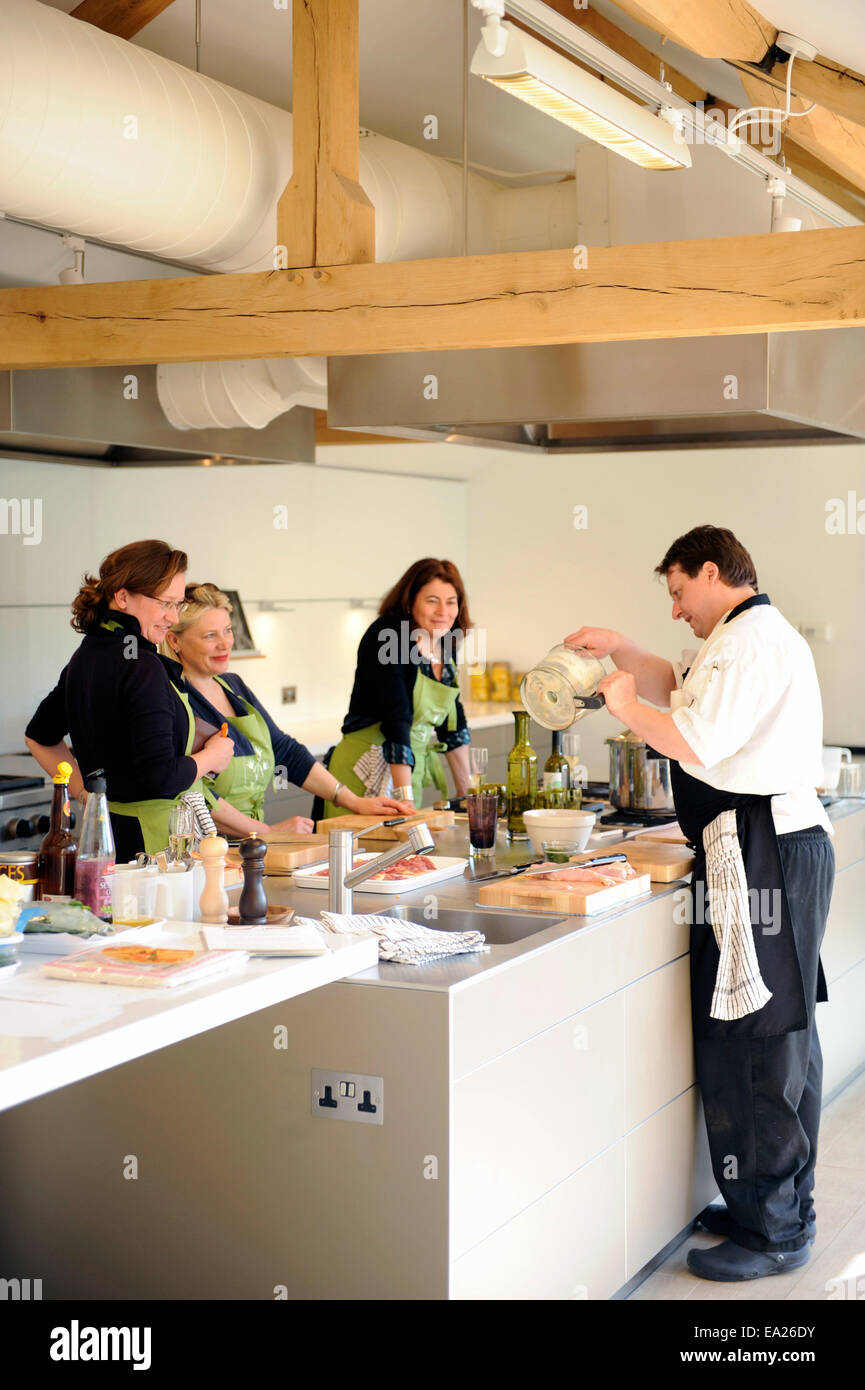 Learning how to chop up a chicken during a cookery course at Thyme at ...