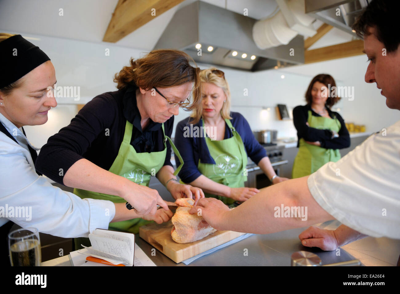 Learning how to chop up a chicken during a cookery course at Thyme at ...