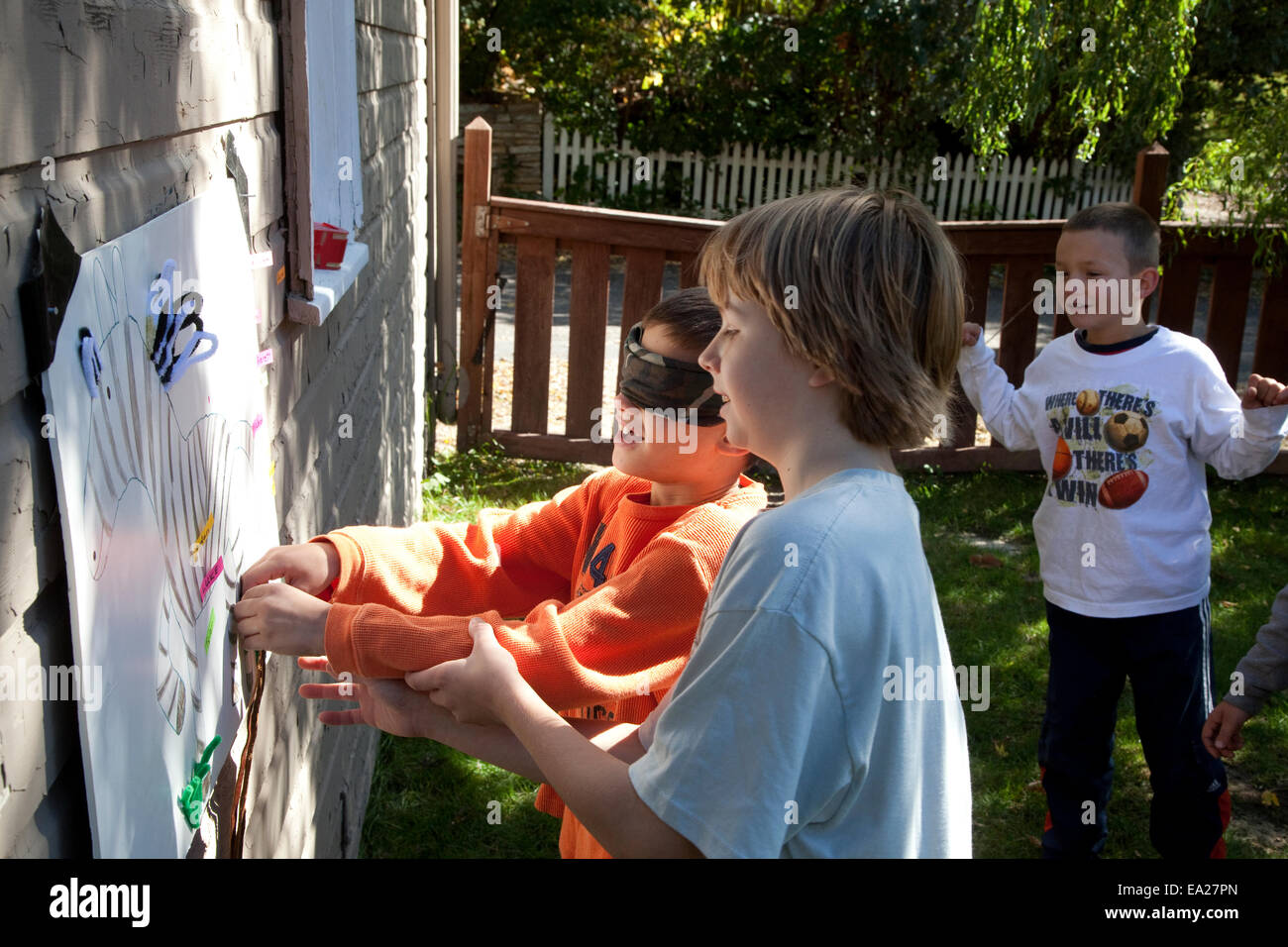 Kids Playing Pin The Tail On The Donkey