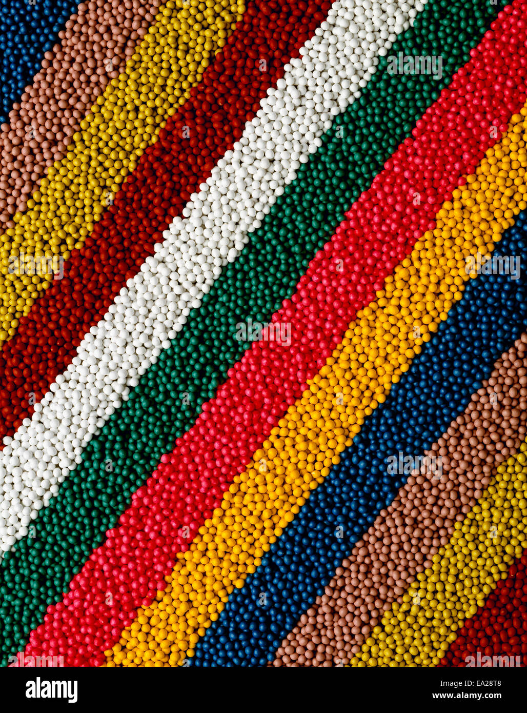 Agriculture - Coated vegetable seeds in rows Stock Photo - Alamy