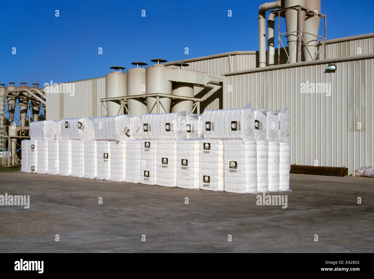 Agriculture - Packaged bales of processed cotton await shipping at a ...