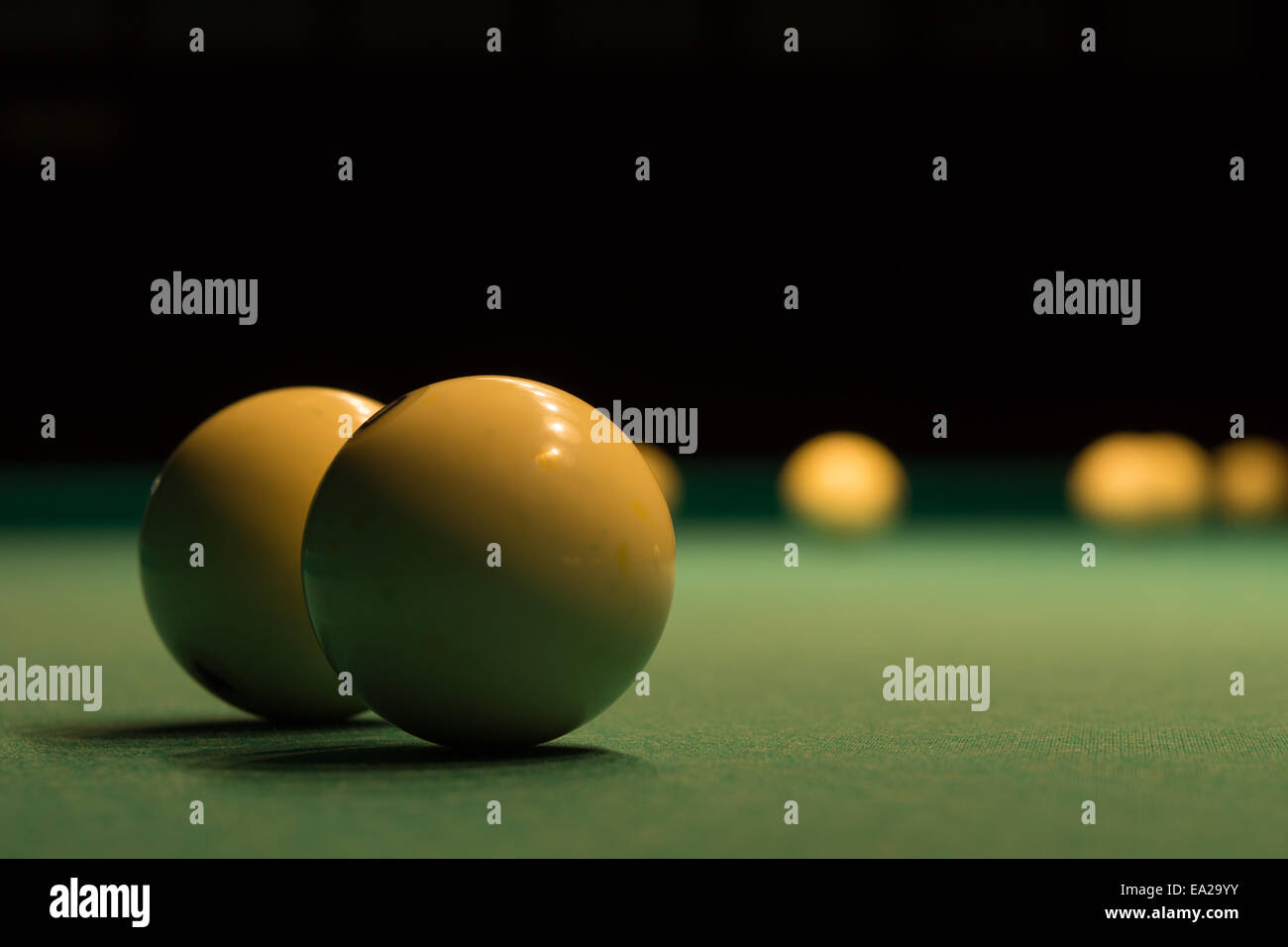 Close up White Shiny Billiard Balls on Green Pool Table on Black ...