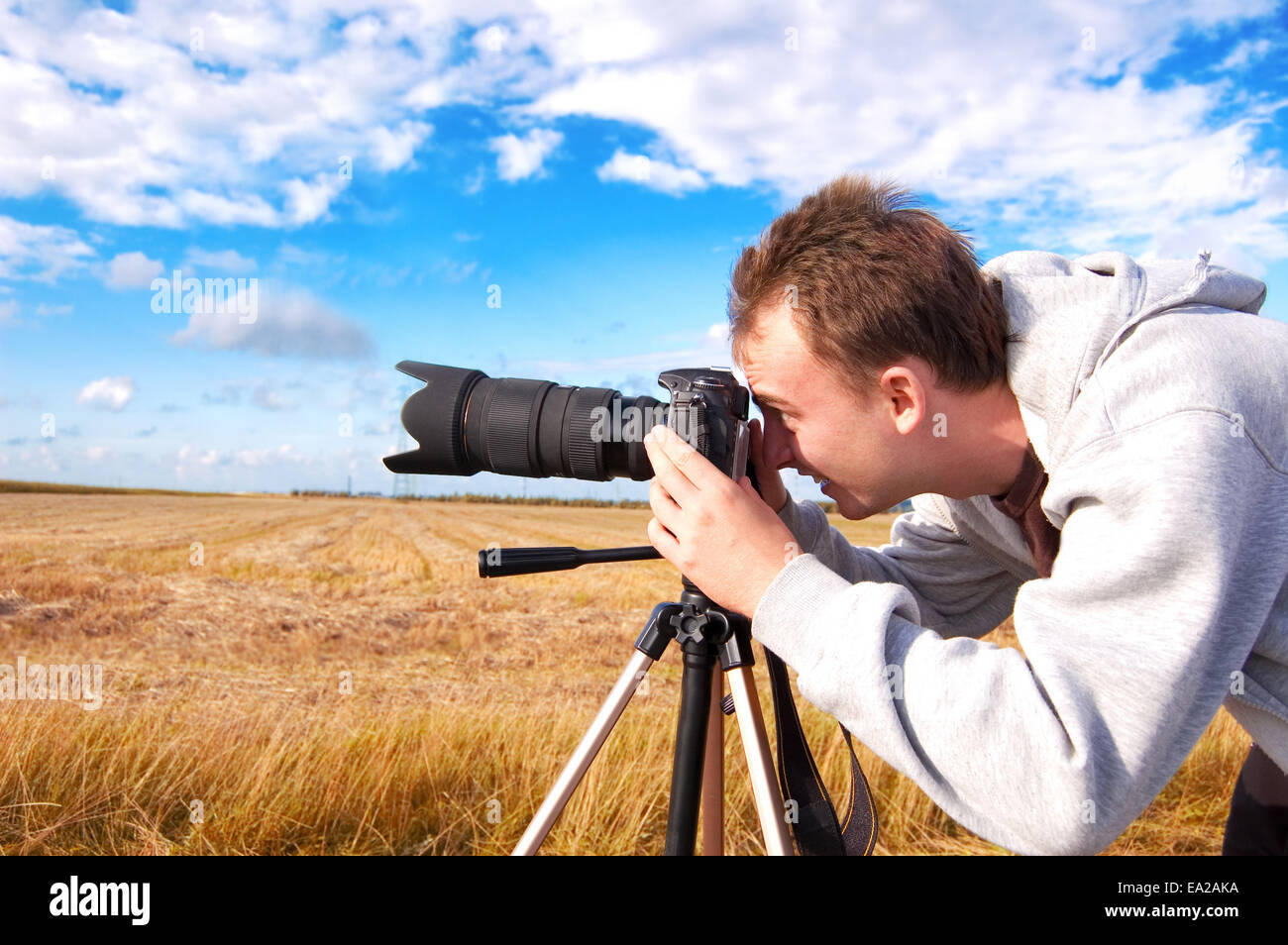 Photographer holding camera big lens hi-res stock photography and ...