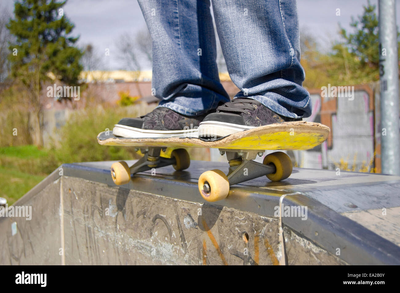Skateboarder doing a slide. Picture of skateborad Stock Photo - Alamy