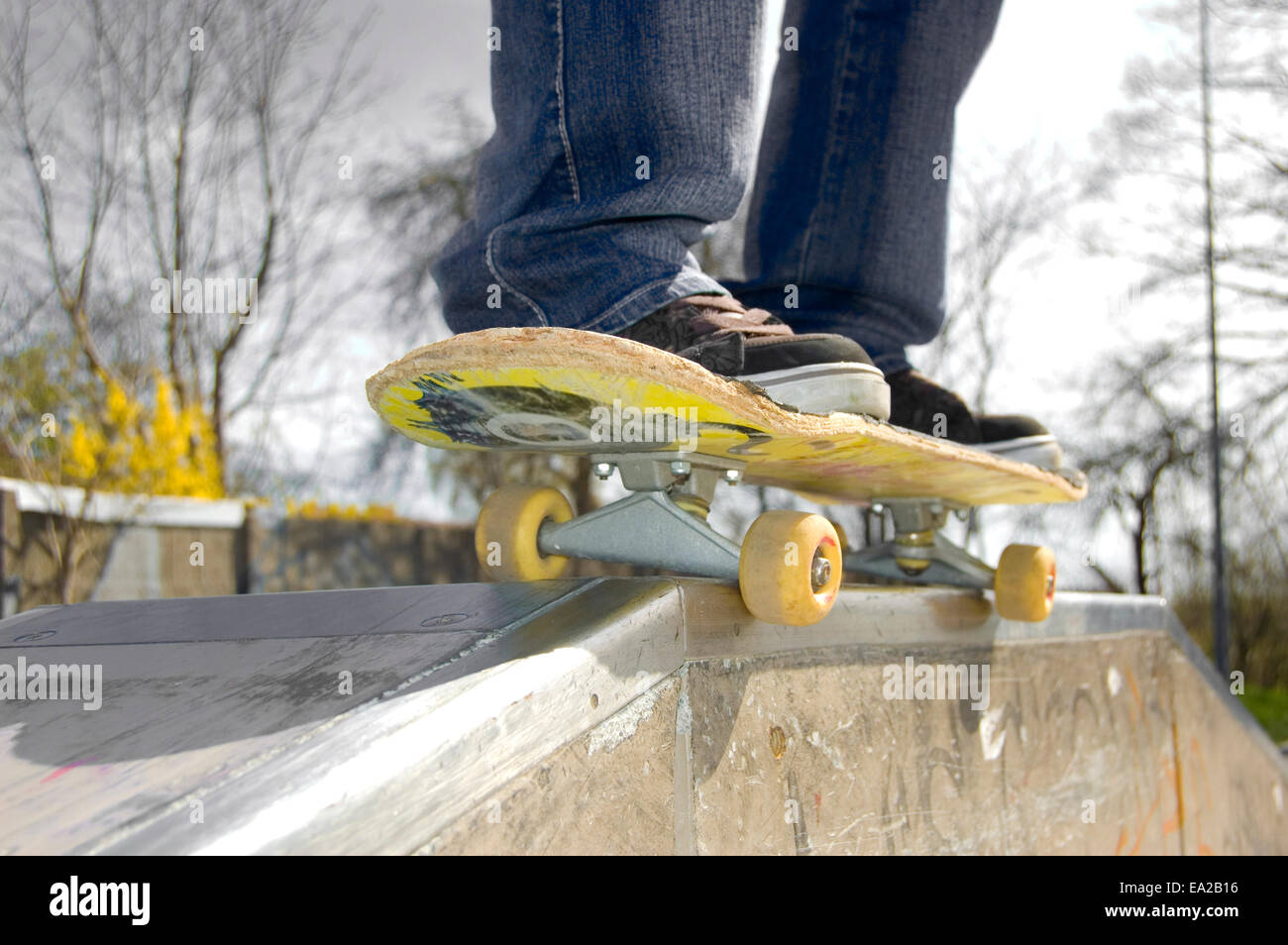 Skateboarder doing a slide. Picture of skateborad Stock Photo - Alamy