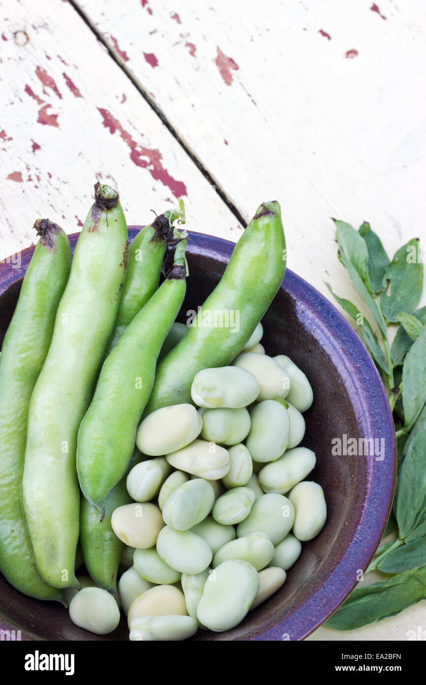bowl with broad beans on a table Stock Photo - Alamy