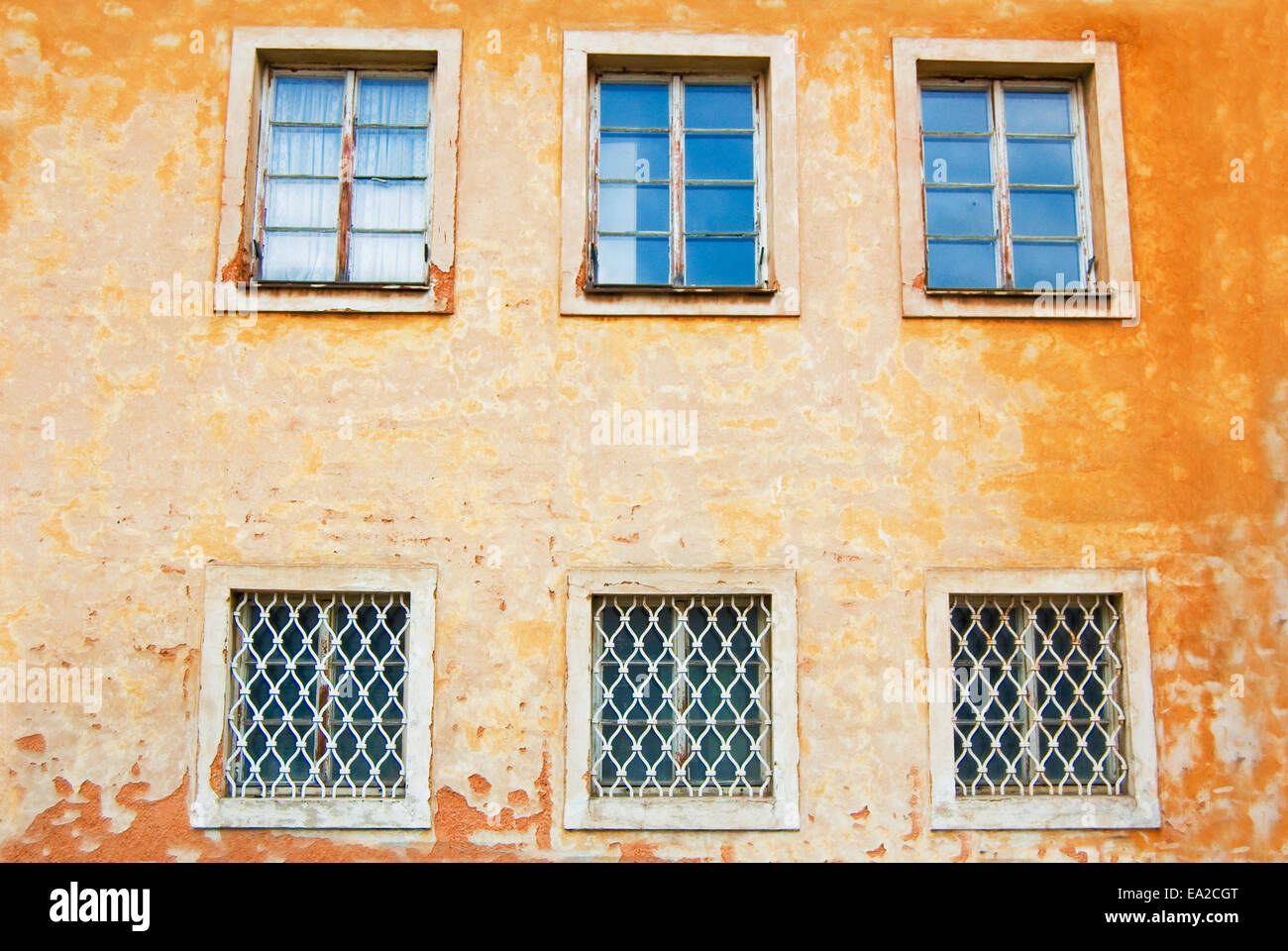 Windows in old orange house Stock Photo - Alamy