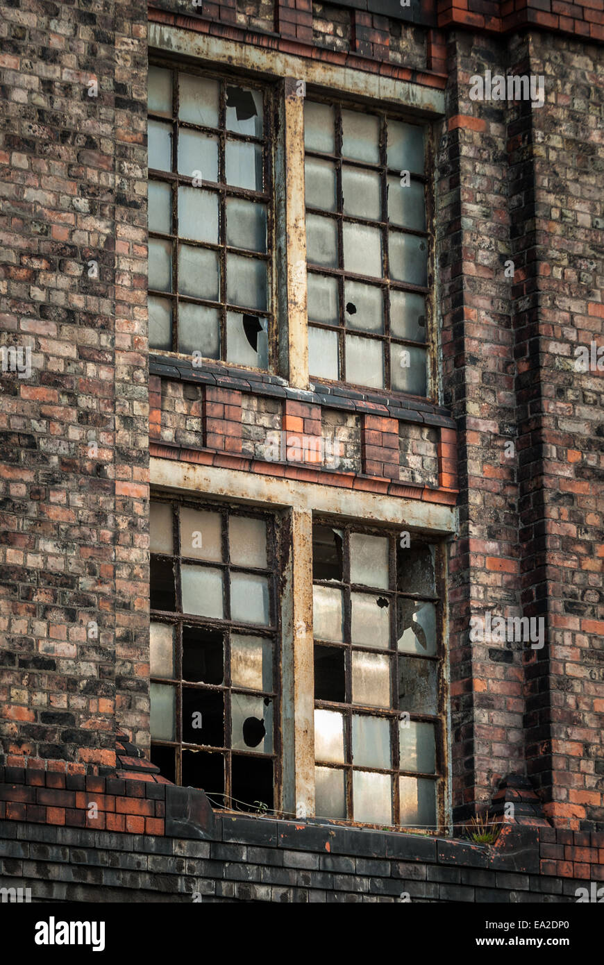 Broken window of a large brick built warehouse at the historic Stock ...