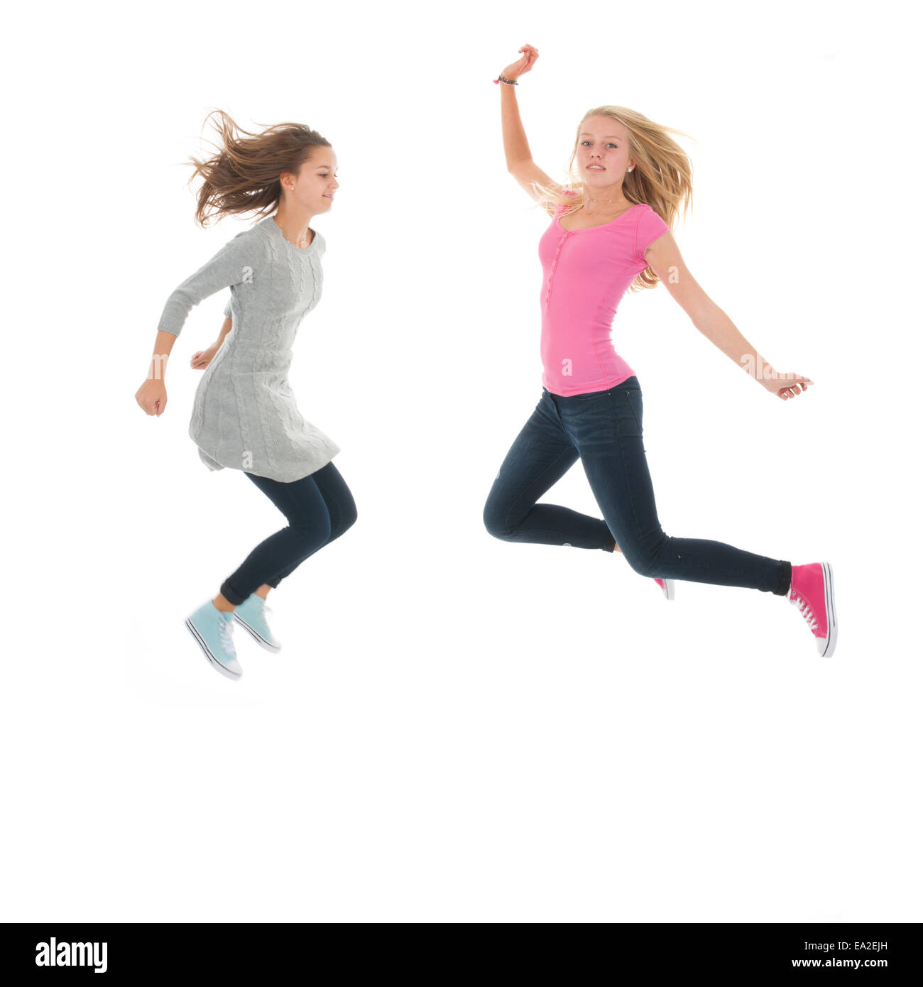 Jumping teenager girls isolated over white background Stock Photo - Alamy