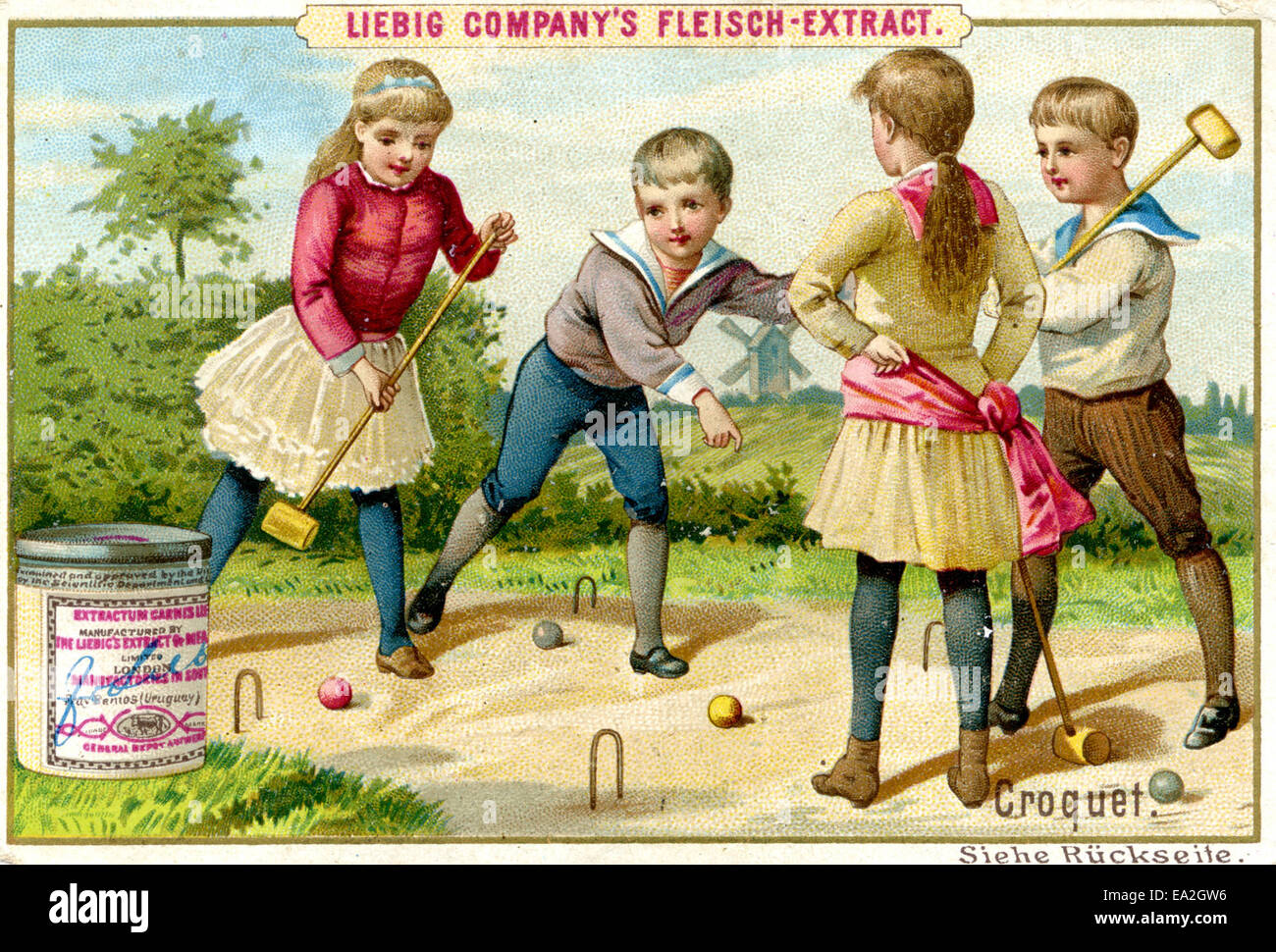 A photograph depicting a game of croquet, a lawn game involving players ...