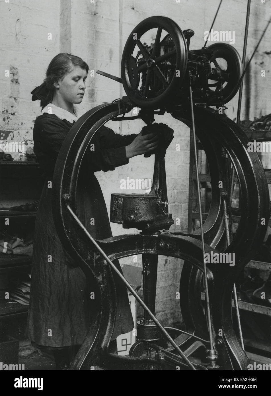 Girl operating stitching machine in Leicestershire boot factory Stock ...