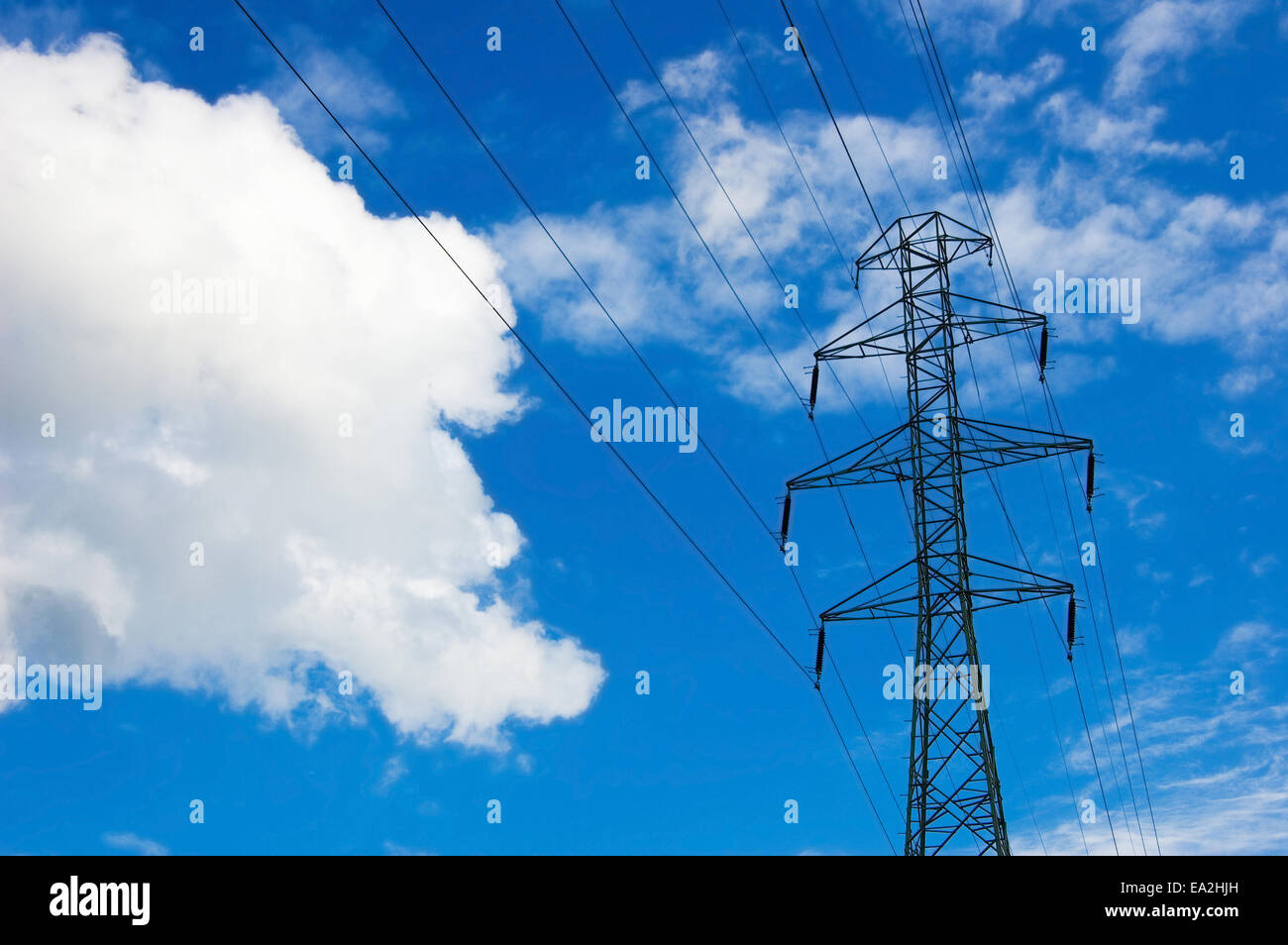 Power lines against the blue sky Stock Photo - Alamy