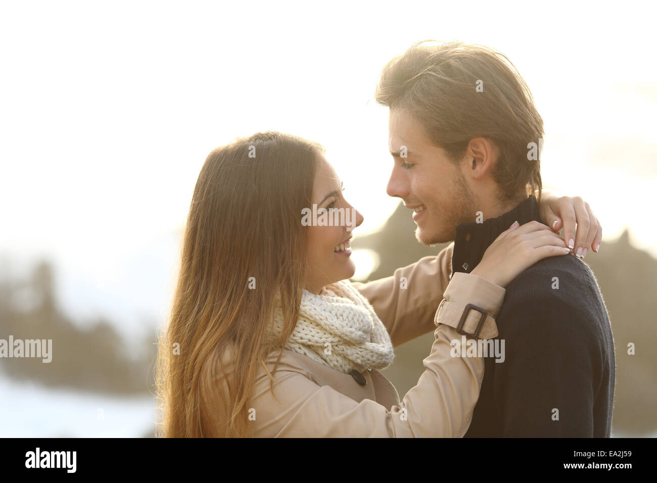 Side view attractive couple hugging hi-res stock photography and images ...