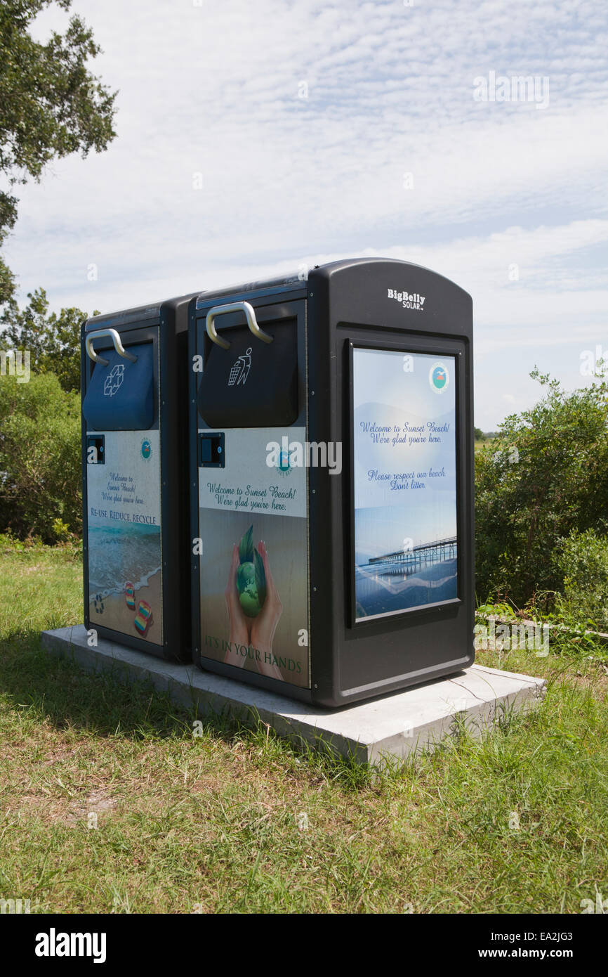 Solar powered combination of a trash can and compacter Stock Photo - Alamy
