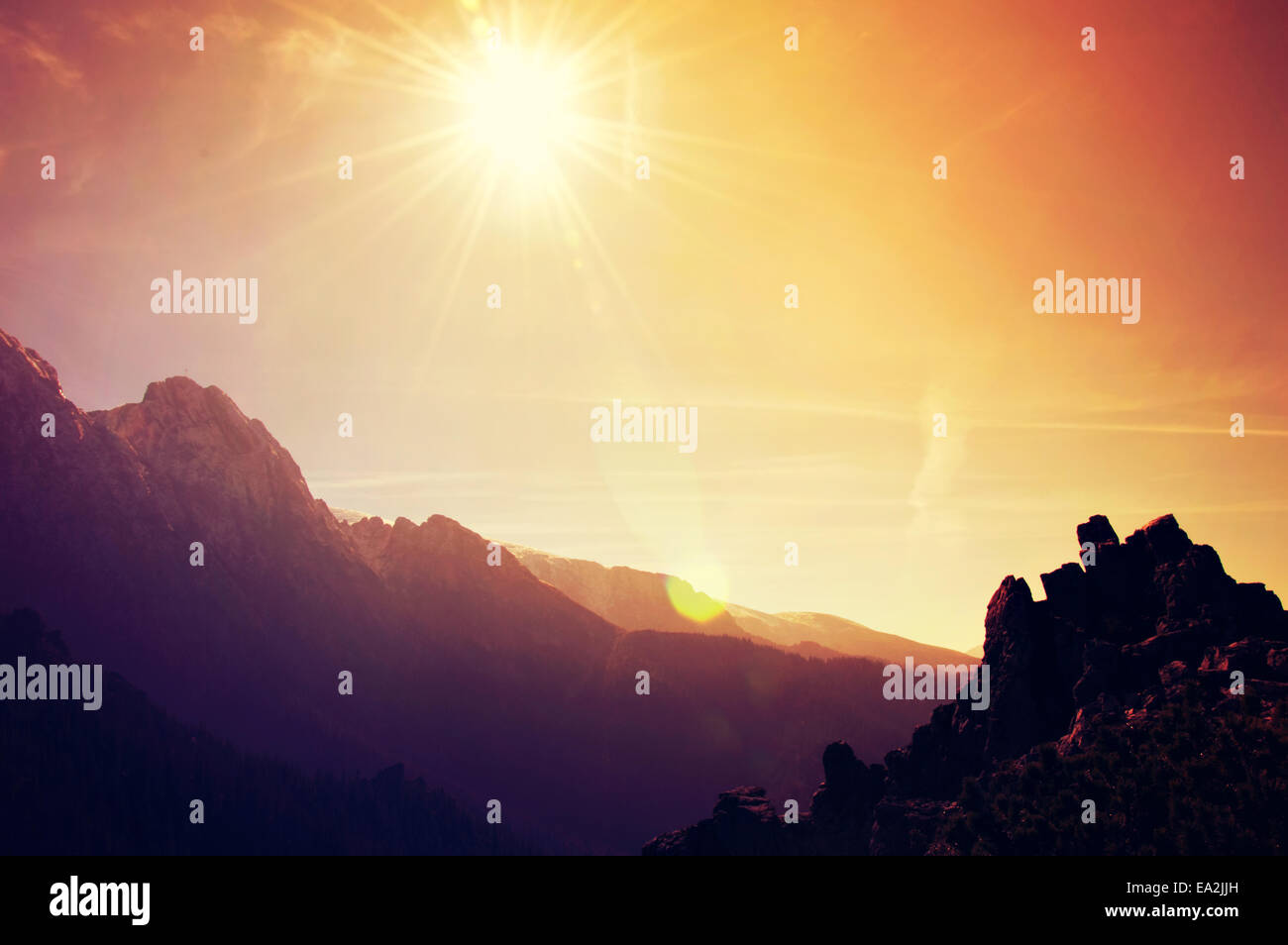 Red sun and sky over mountains. Nature conceptual image Stock Photo - Alamy