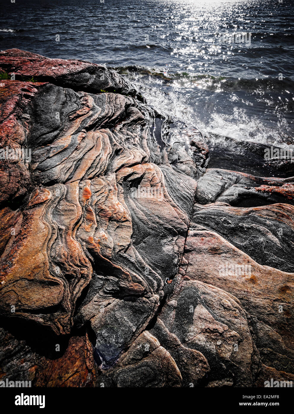 Exposed bedrock and colorful rock formations at rugged Georgian Bay ...