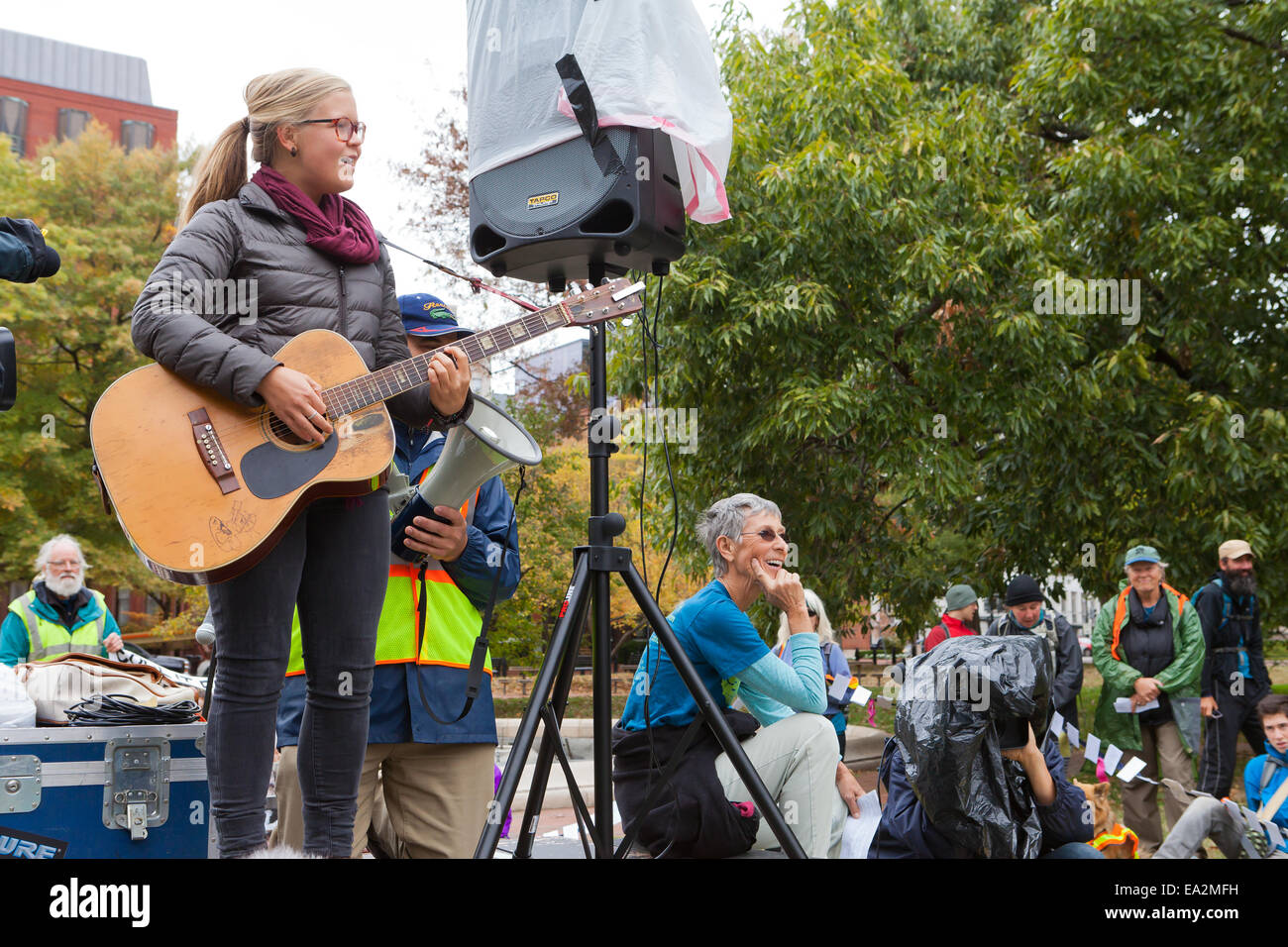 Female guitar player singer on outdoor stage Stock Photo - Alamy