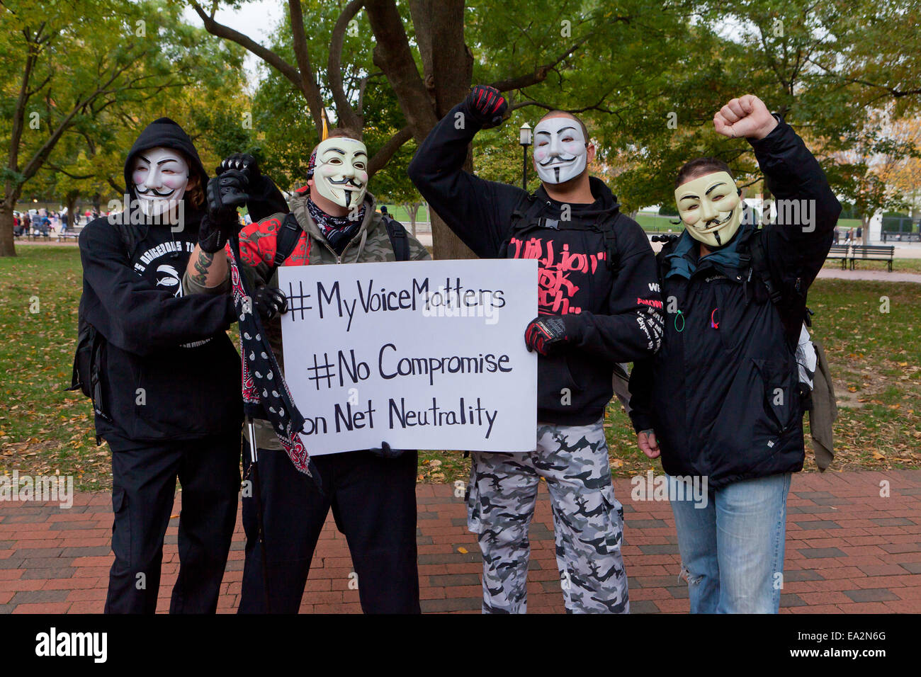 Anonymous members holding pro-net neutrality message - USA Stock Photo ...