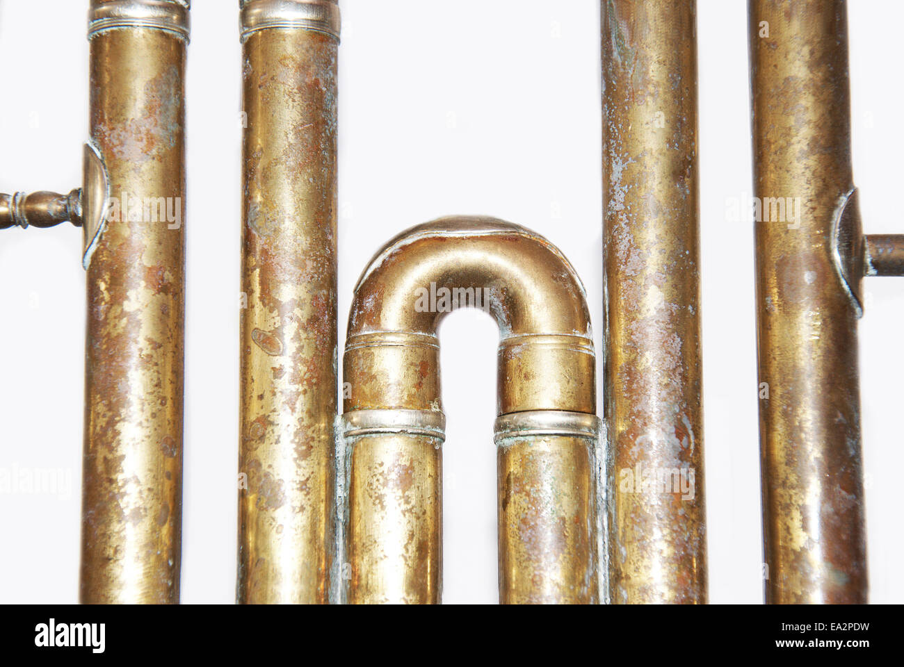 Close up of golden pipes on isolated background Stock Photo - Alamy