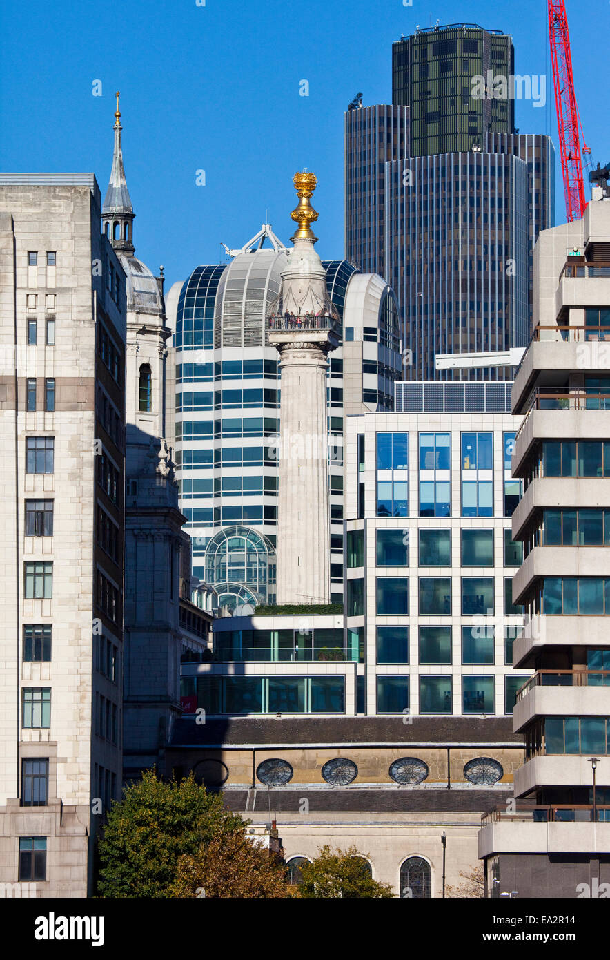 A view of Monument in London, amongst modern high-rise buildings Stock ...