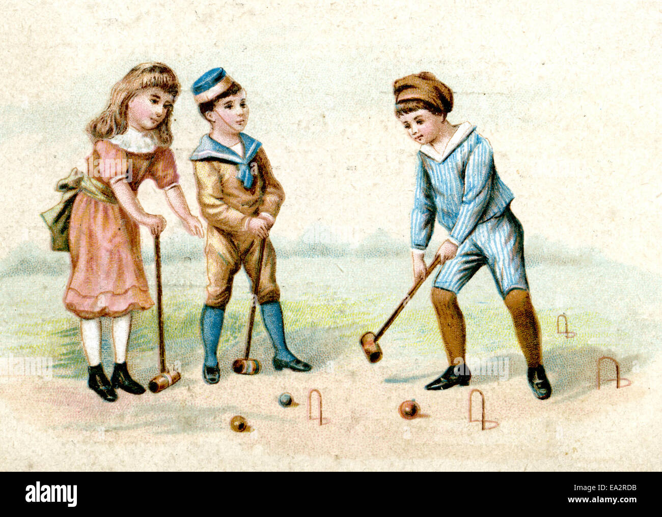 Advertising card depicting three children playing croquet Stock Photo ...