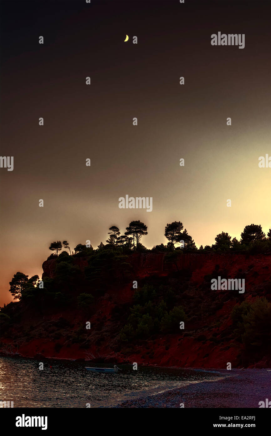 Sea shore surreal photo at night with moon Stock Photo - Alamy