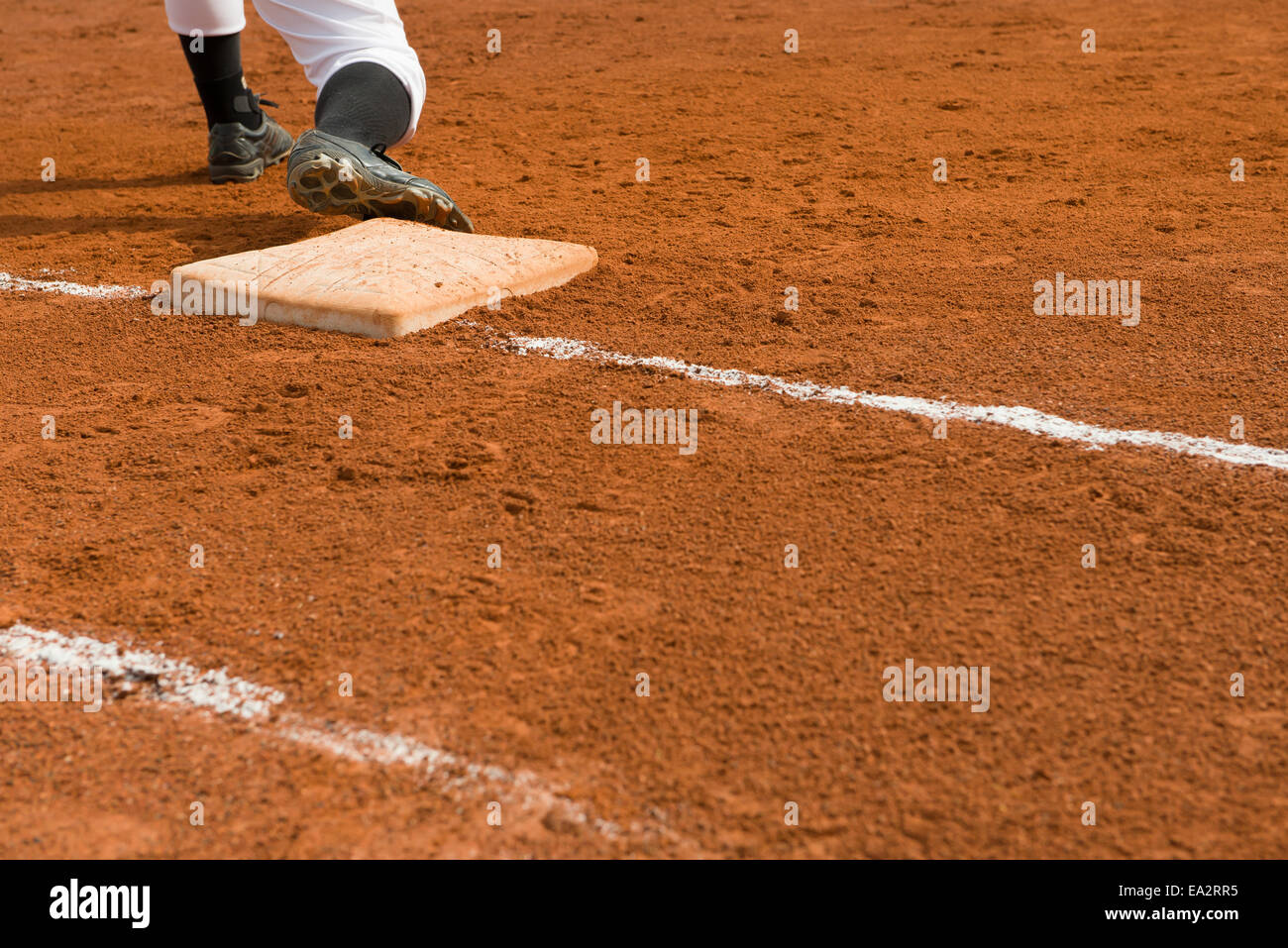 Base man in a baseball game Stock Photo - Alamy