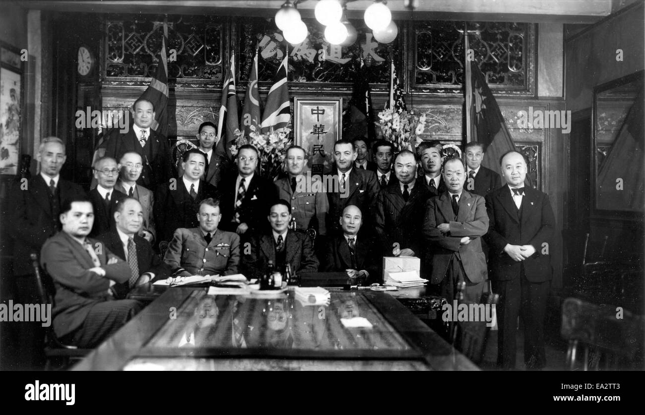 A photograph depicting a group of people gathered for an official event ...