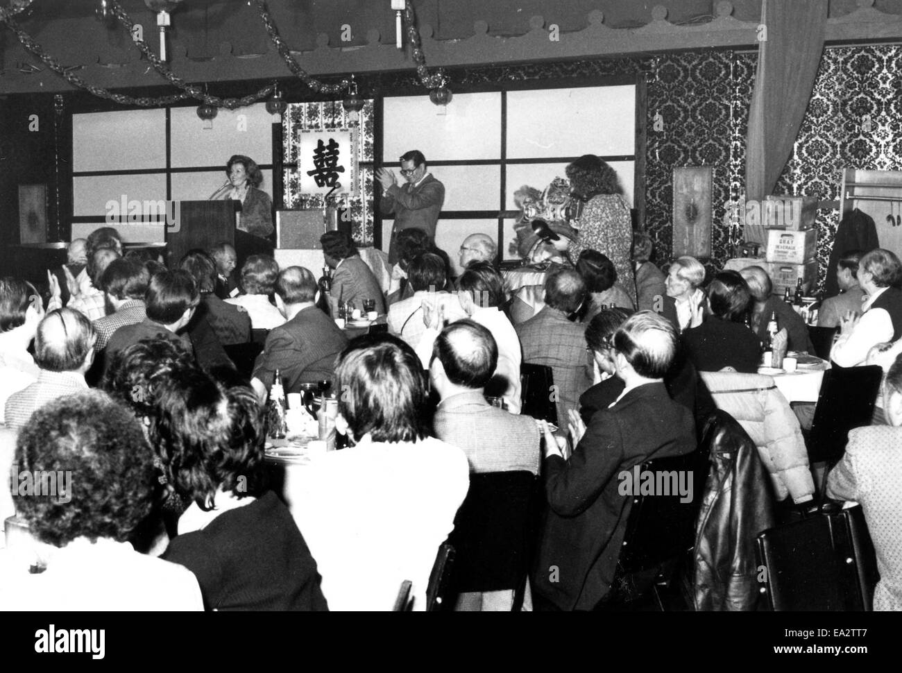This image captures a group of individuals gathered at a Chinese ...