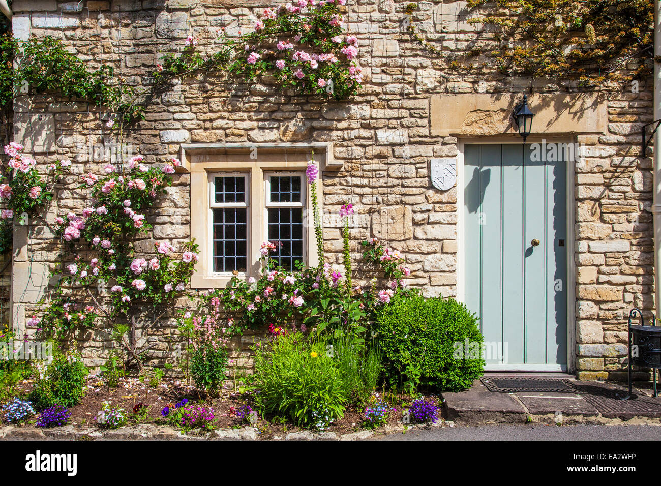 A pretty stone cottage in the Cotswold village of Castle Combe in ...