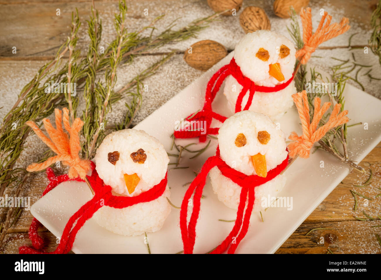 Funny rice snowmen, a kid meal for Christmas Stock Photo - Alamy