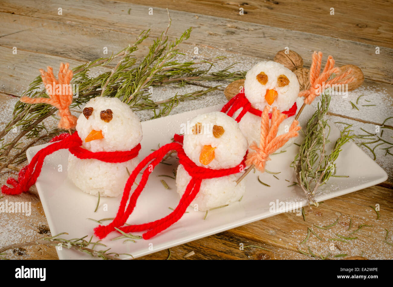 Funny rice snowmen, a kid meal for Christmas Stock Photo - Alamy