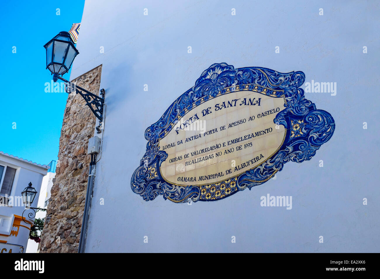 Traditional local street sign and street lamp, Old Town, Albufeira ...