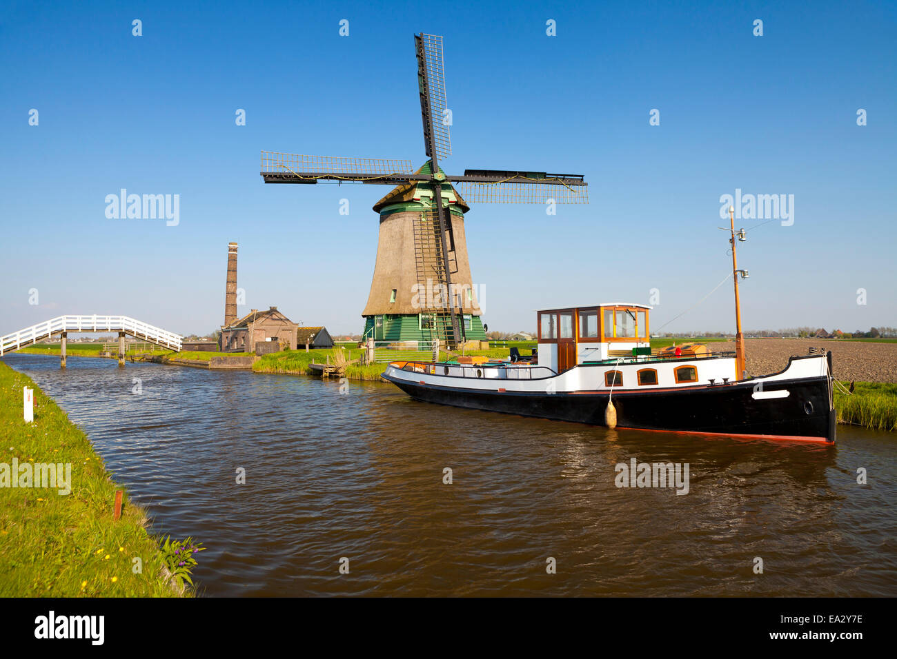 Traditional Windmill beside a Canal, near Obdam, North Holland ...