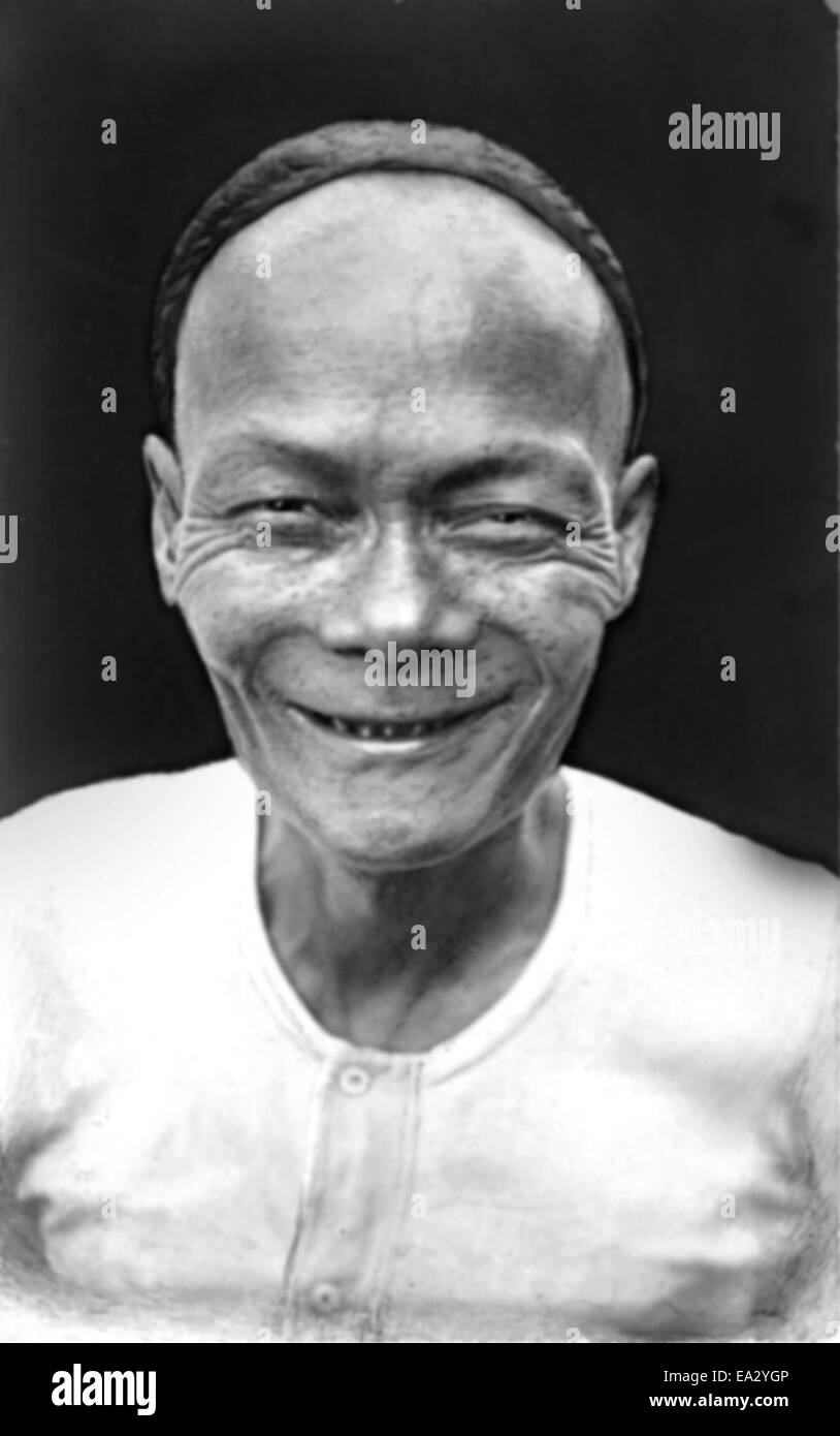 This portrait captures a Chinese man smiling, offering a glimpse into ...