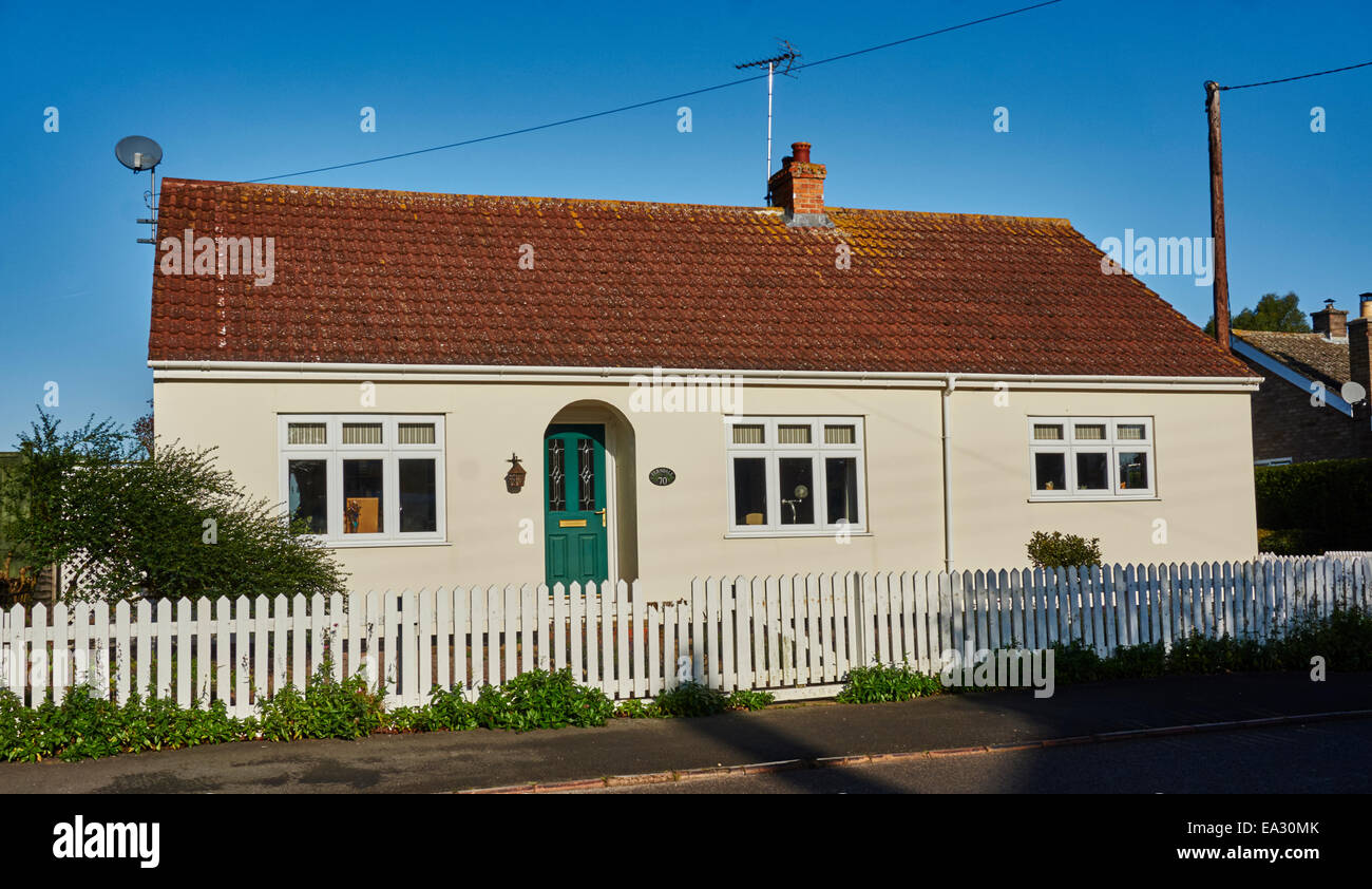 Rendered bungalow facing the sun against a clear, blue sky in Langtoft ...