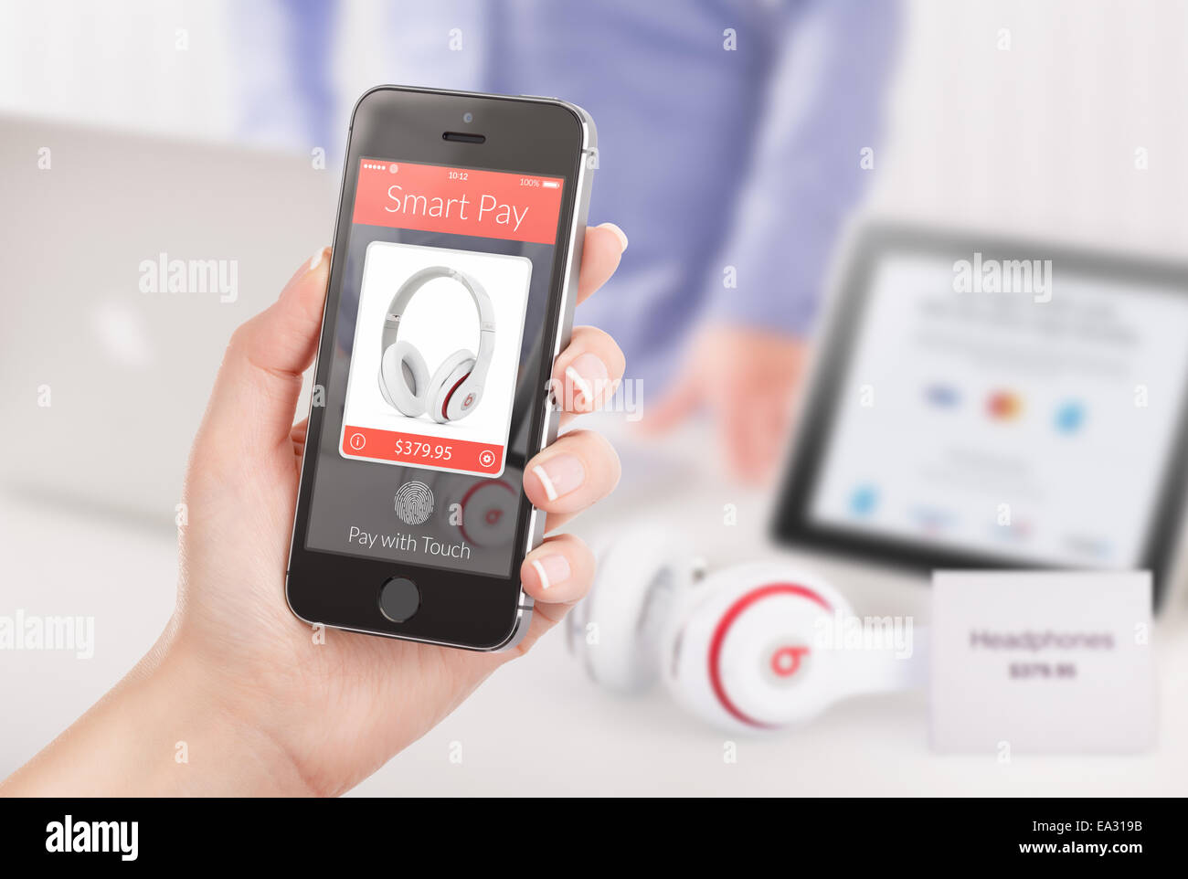 Woman is buying headphones by black mobile smart phone with nfc smart ...