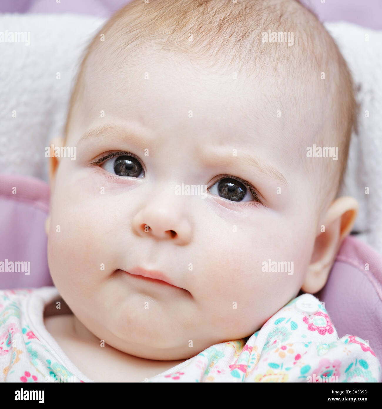 Very serious baby Stock Photo - Alamy