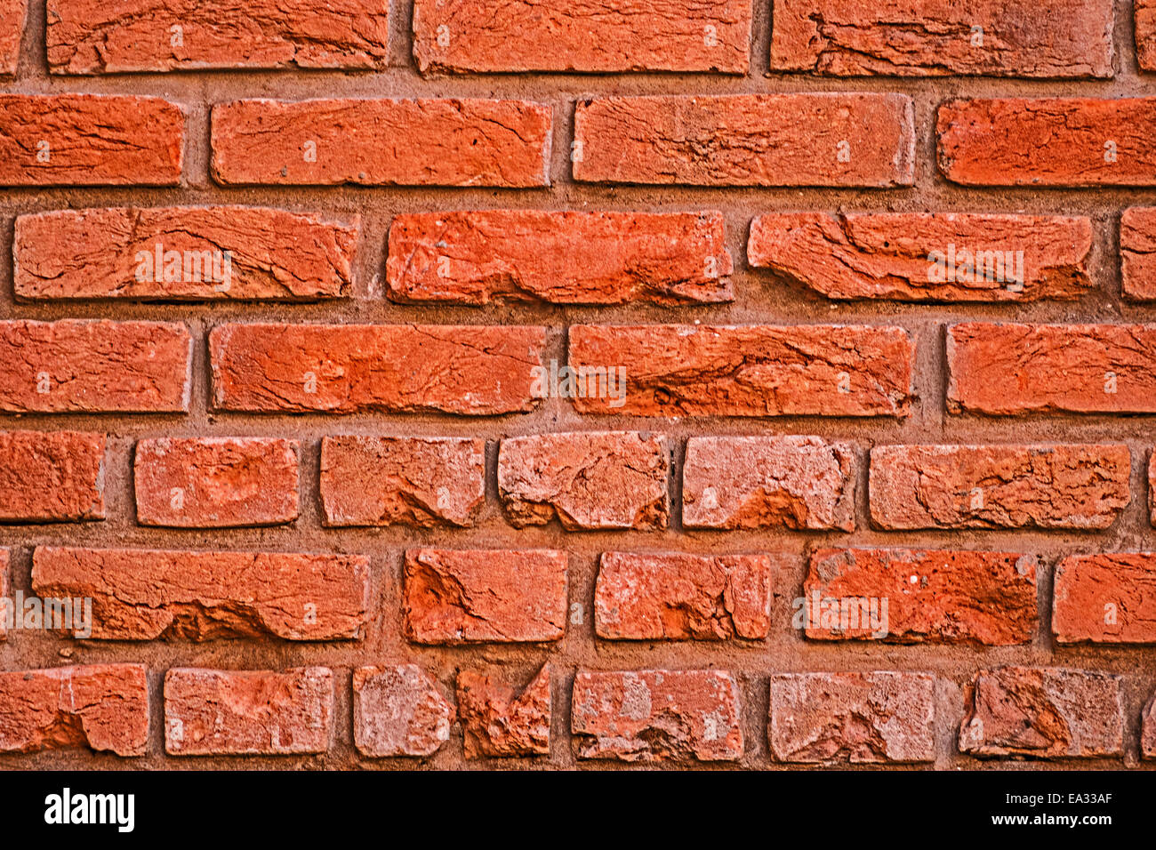 Ornamental brick wall painted in red Stock Photo - Alamy
