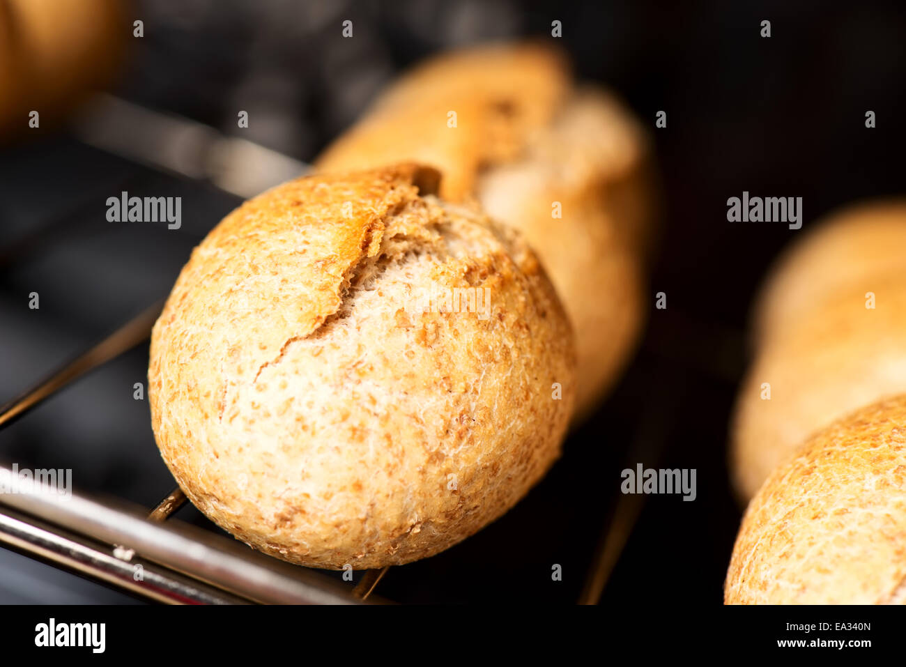Bread in oven close up Stock Photo - Alamy