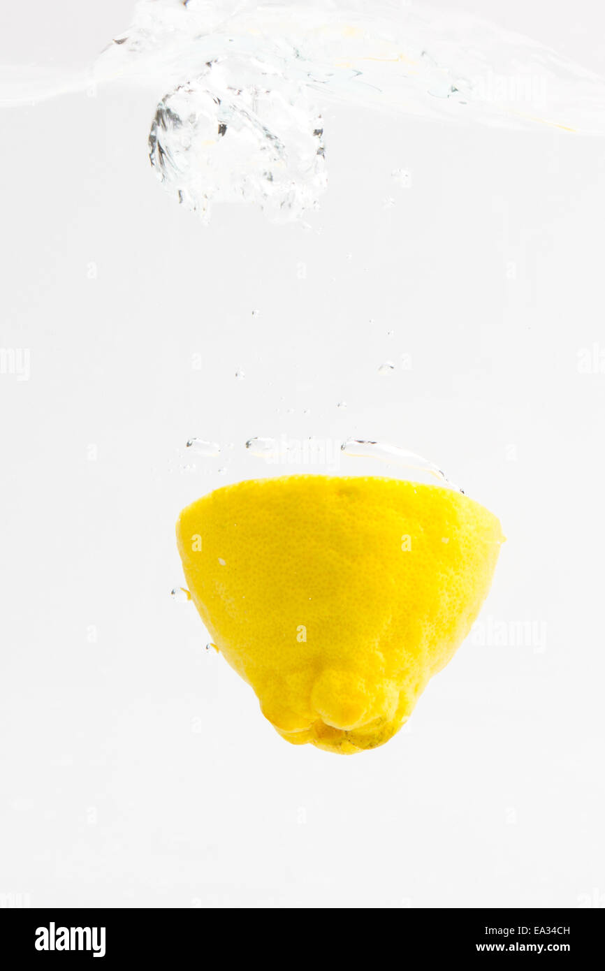 Lemon with water splash Stock Photo - Alamy