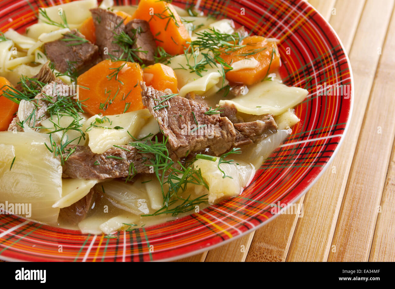 Kullama. boiled meat with noodles Stock Photo - Alamy